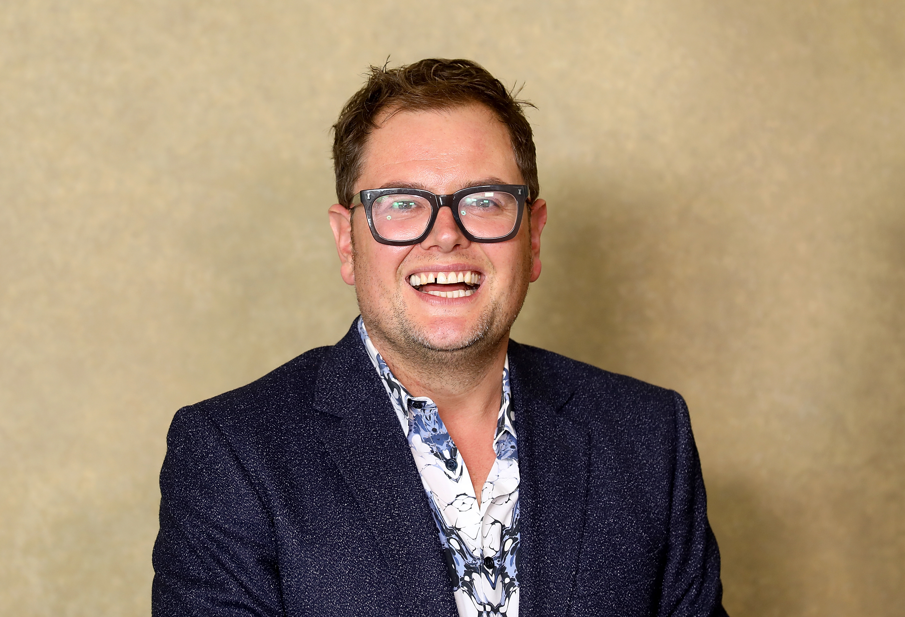 Alan Carr hilariously explains how he was outed by a Ouija board
