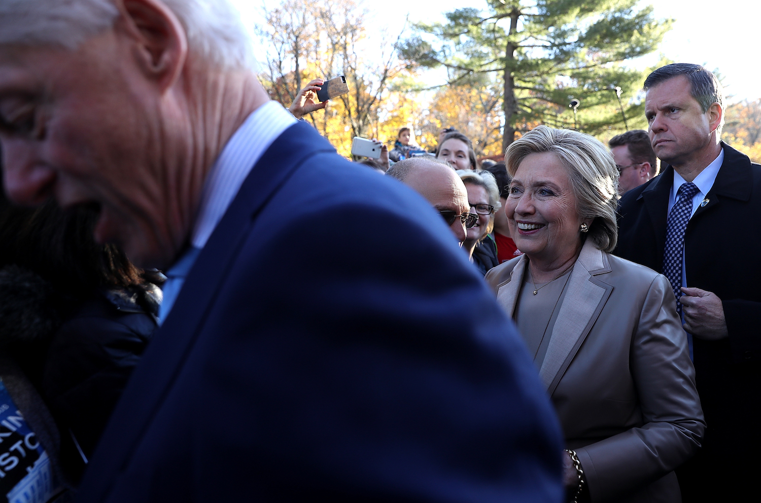 Hillary Clinton's husband overshadows her big voting moment with figure ...