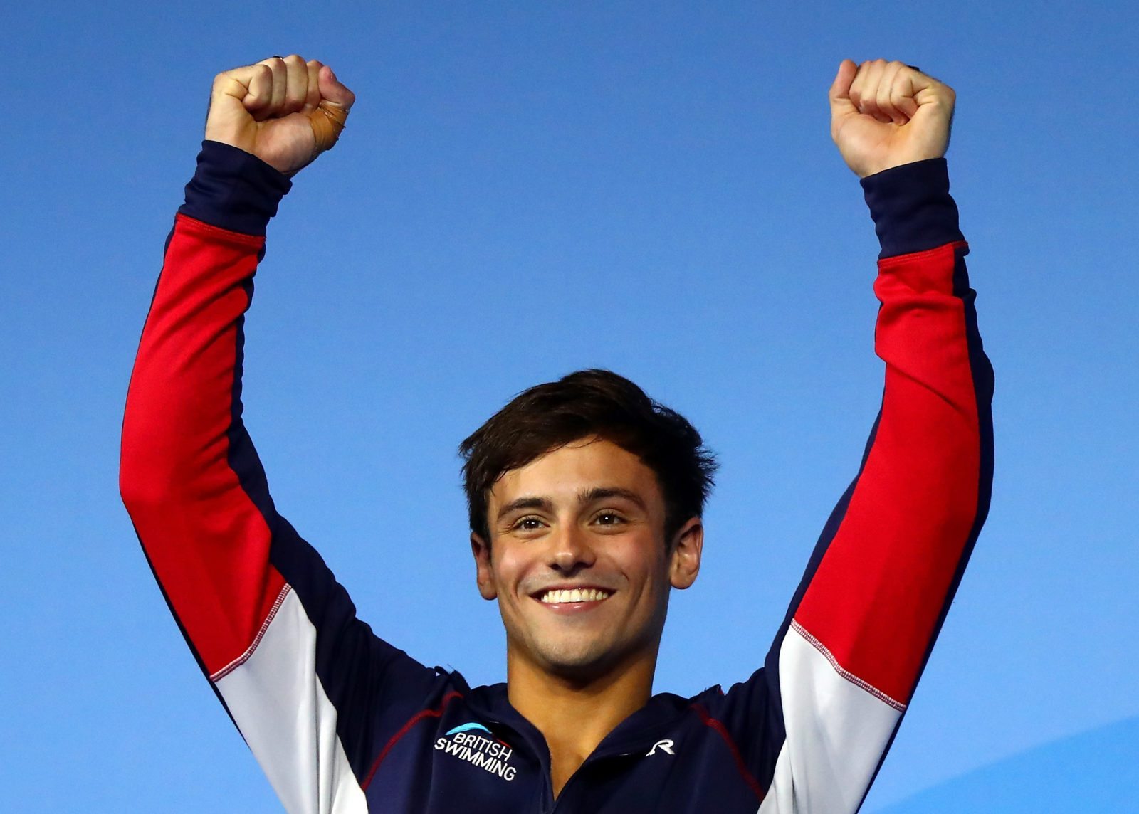 Tom Daley wore a Pride badge on the podium after winning a medal in ...