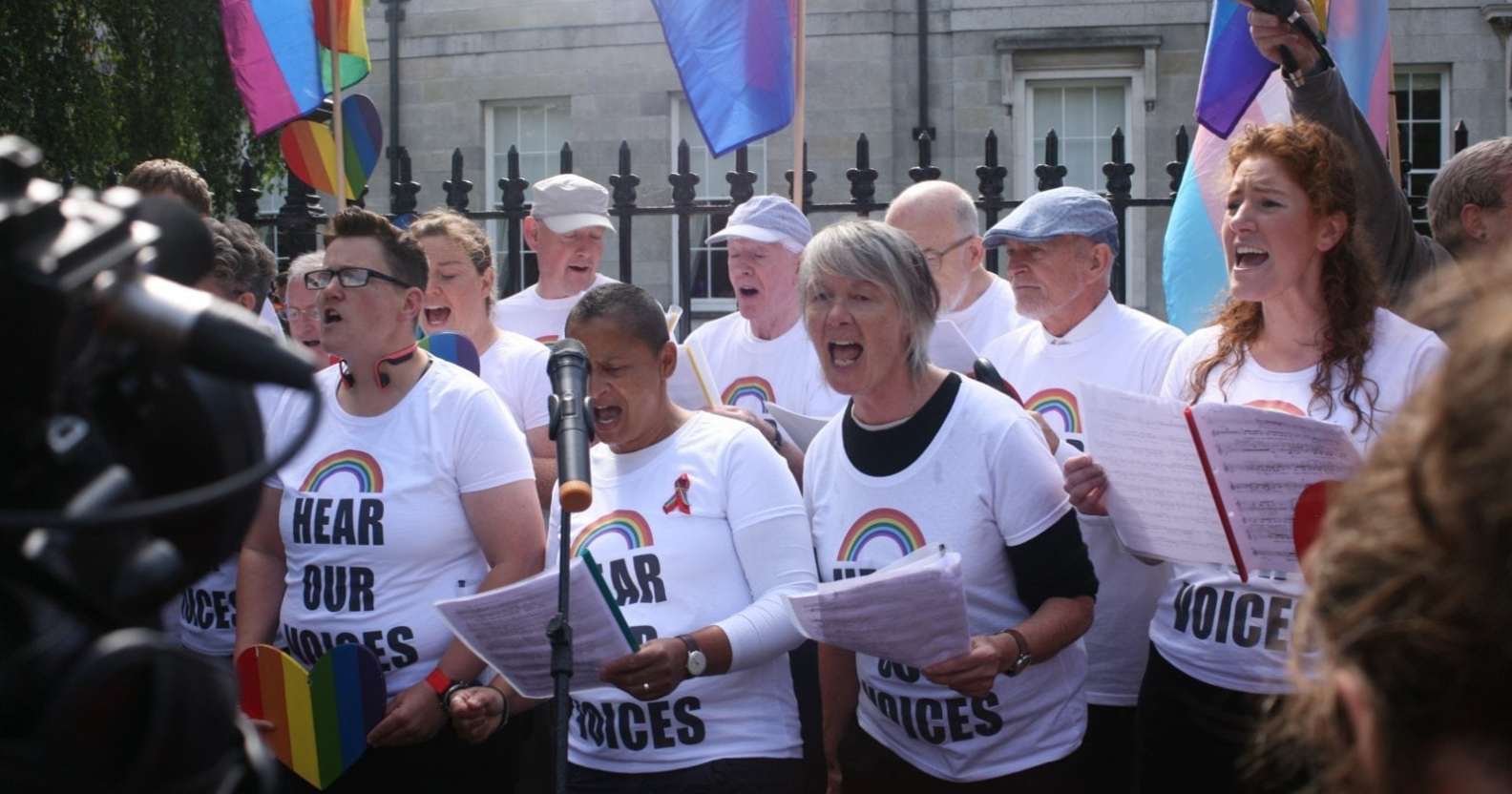 LGBT choir sings 'We Are Family' outside venue to protest queer ...