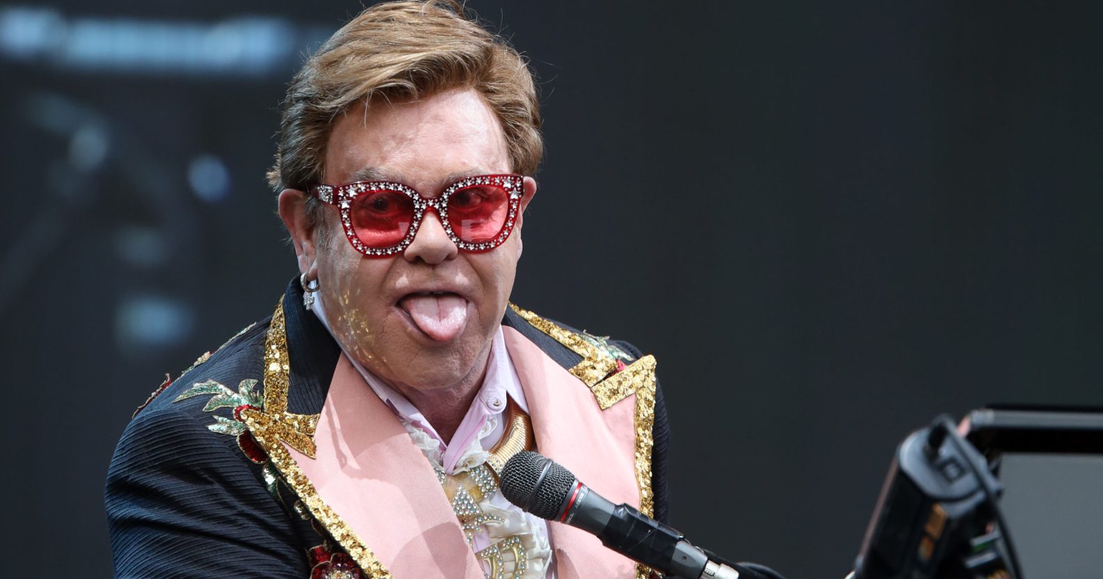 Elton John was terrified his wig would fly off when a storm hit his concert