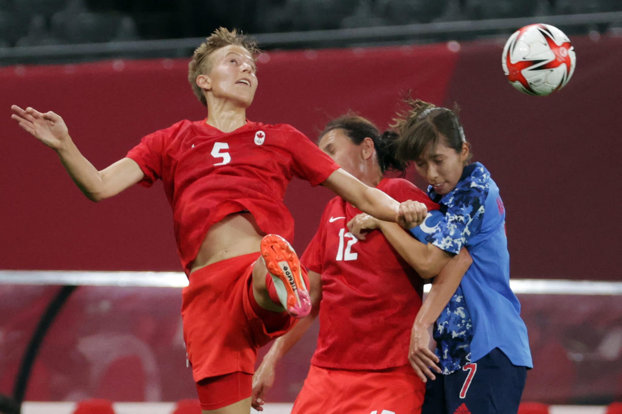 Footballer Quinn makes history as first out trans Olympian to compete ...