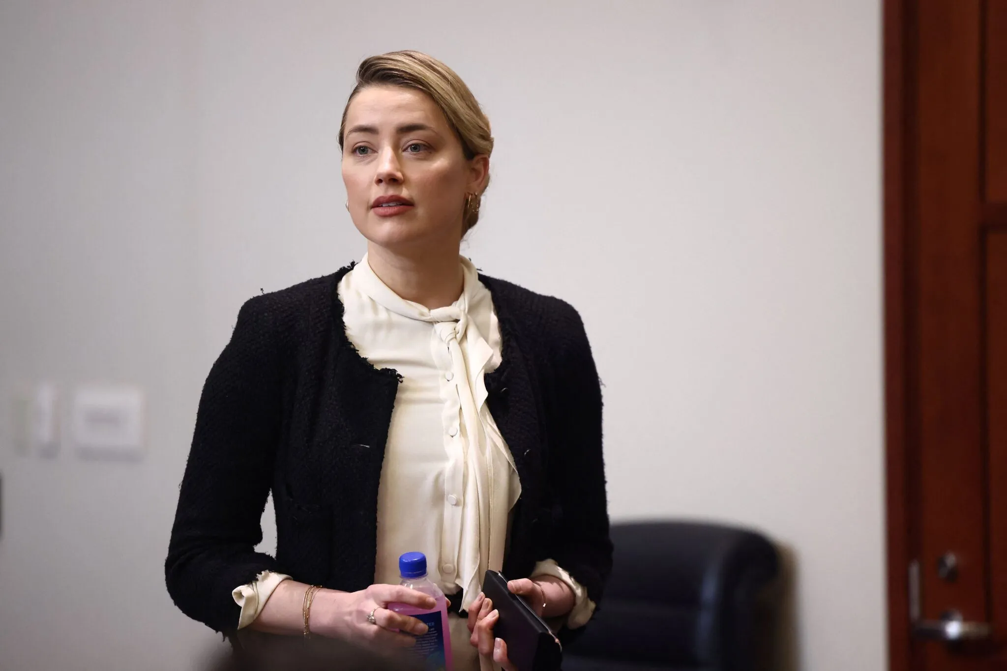 Amber Heard denies assaulting ex-girlfriend in Johnny Depp trial