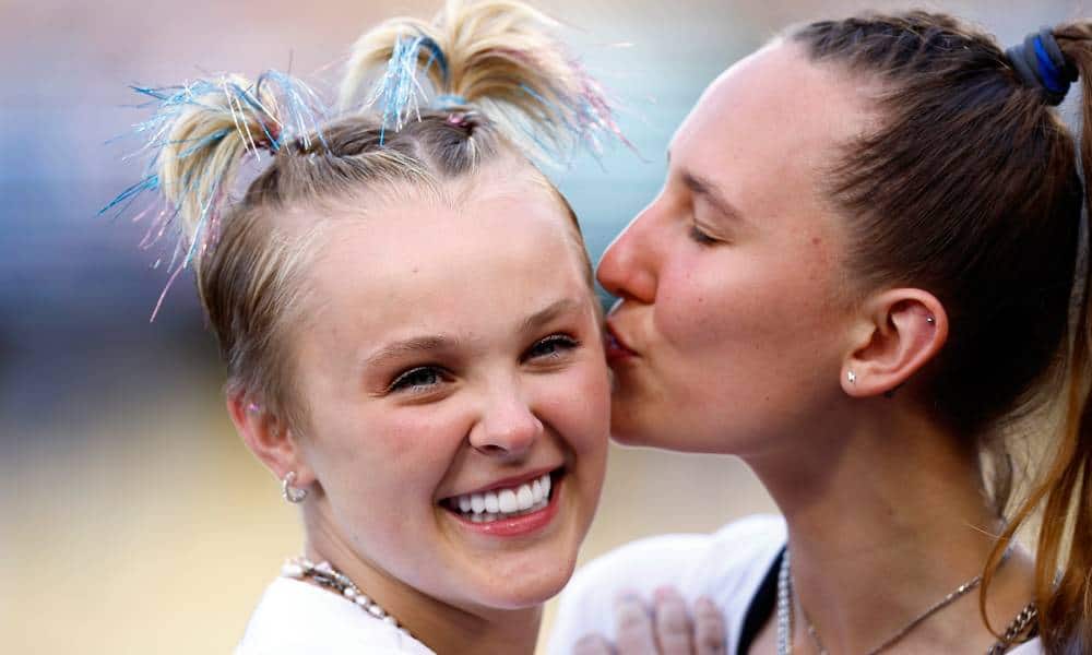 JoJo Siwa and Kylie Prew caught on kiss cam at LGBTQ+ baseball event