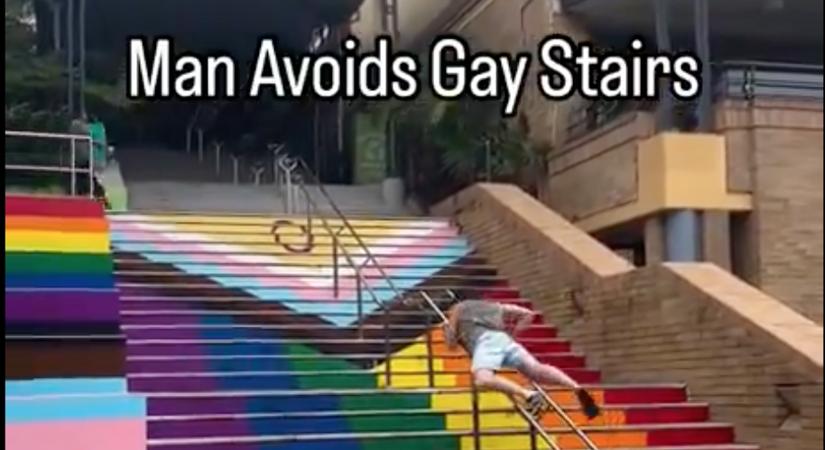 Man humps his way up railings to avoid using 'woke' Pride stairs