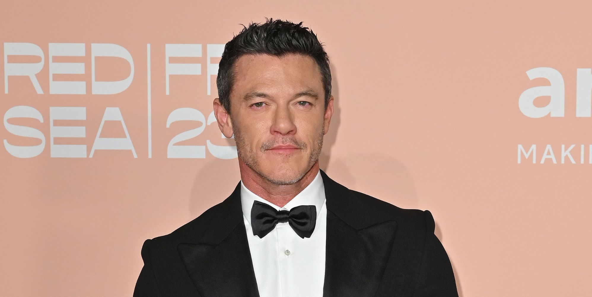 Luke Evans shows off skimpy swimwear with boyfriend Fran Tomas