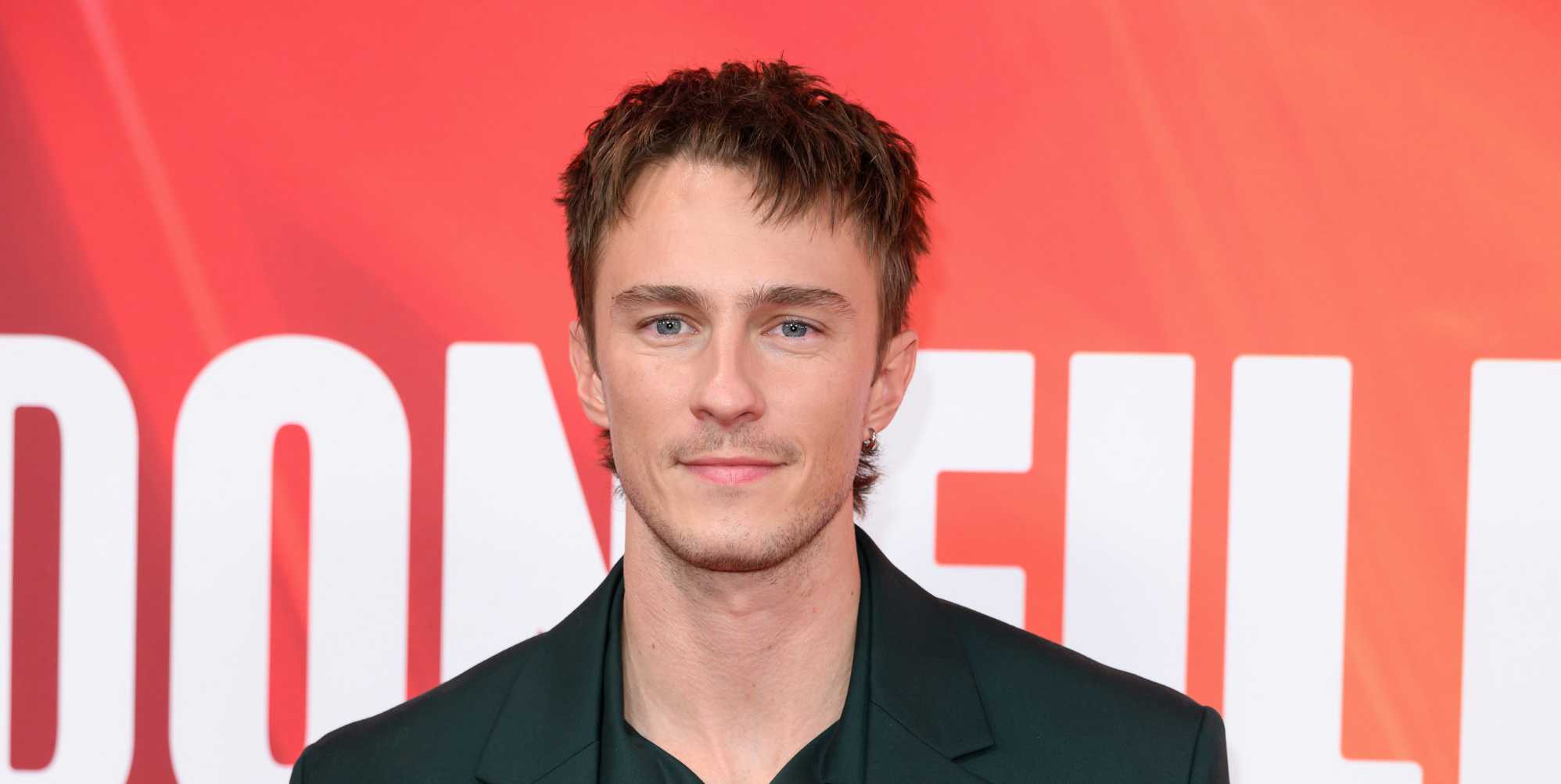 Dylan O'Brien in red lingerie in Fantasmas has the gays thirsting