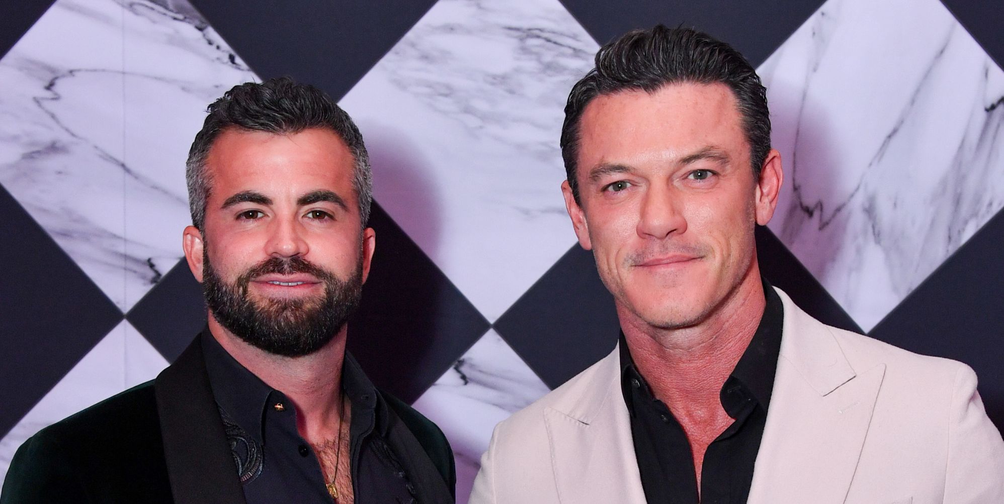 Luke Evans shows off skimpy swimwear with boyfriend Fran Tomas