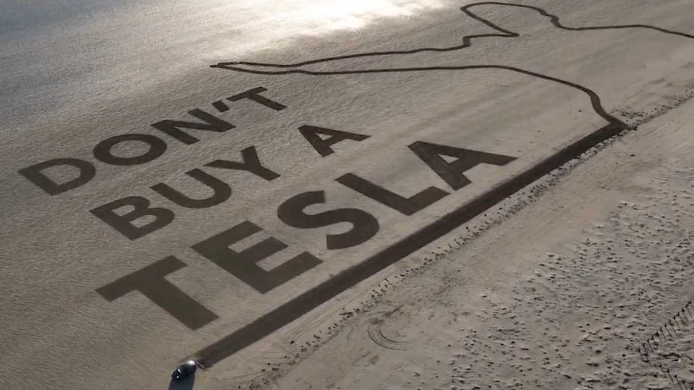 Led By Donkeys stage giant 'don't buy a Tesla' protest on beach