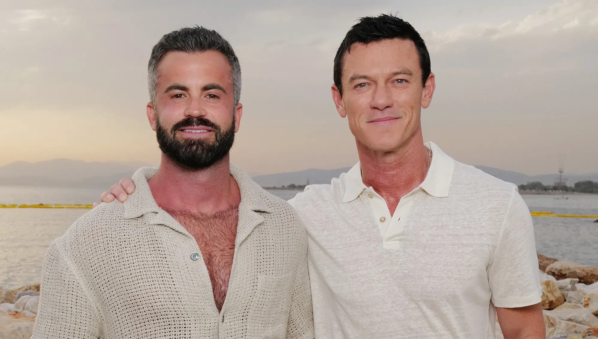 Luke Evans shows off skimpy swimwear with boyfriend Fran Tomas