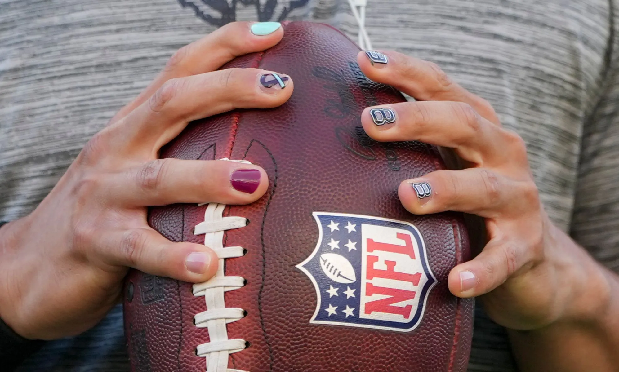 NFL star Caleb Williams paints nails in honour of suicide hotline