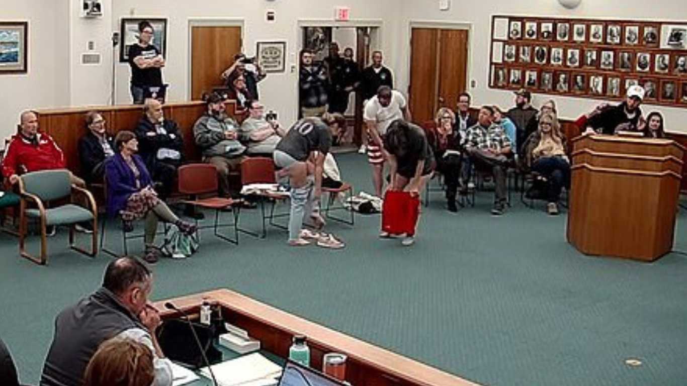 Moms for Liberty chair strips in bizarre anti-trans protest