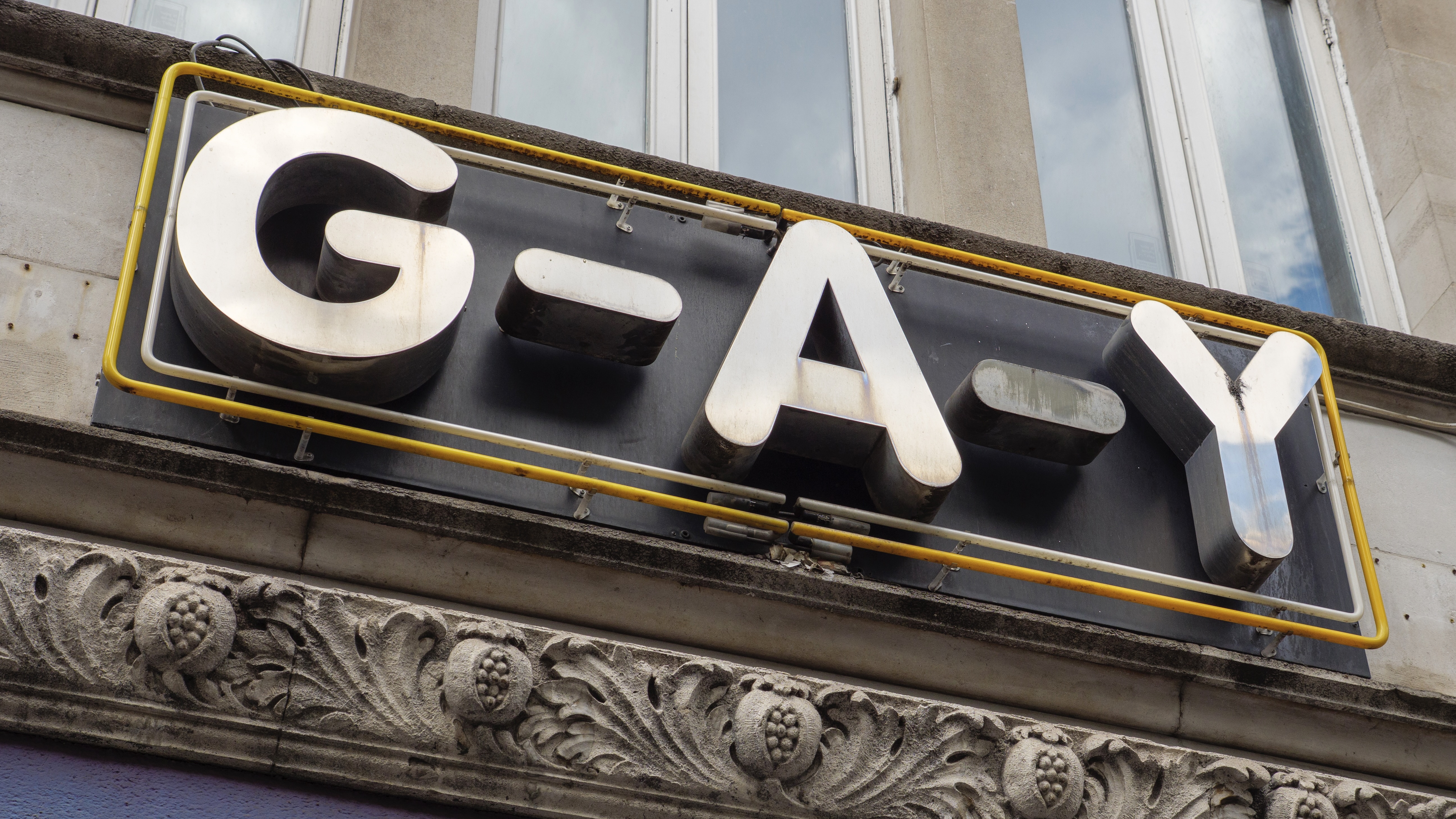 The NSFW meaning behind the popular LGBTQ+ arm band tattoo